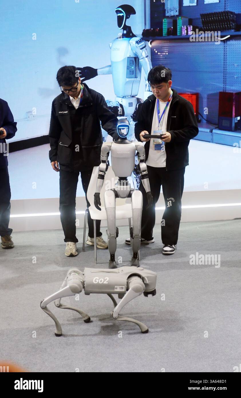 SHANGHAI, CHINA - MARCH 20, 2025 - Visitors visit UNITREE G1 humanoid ...