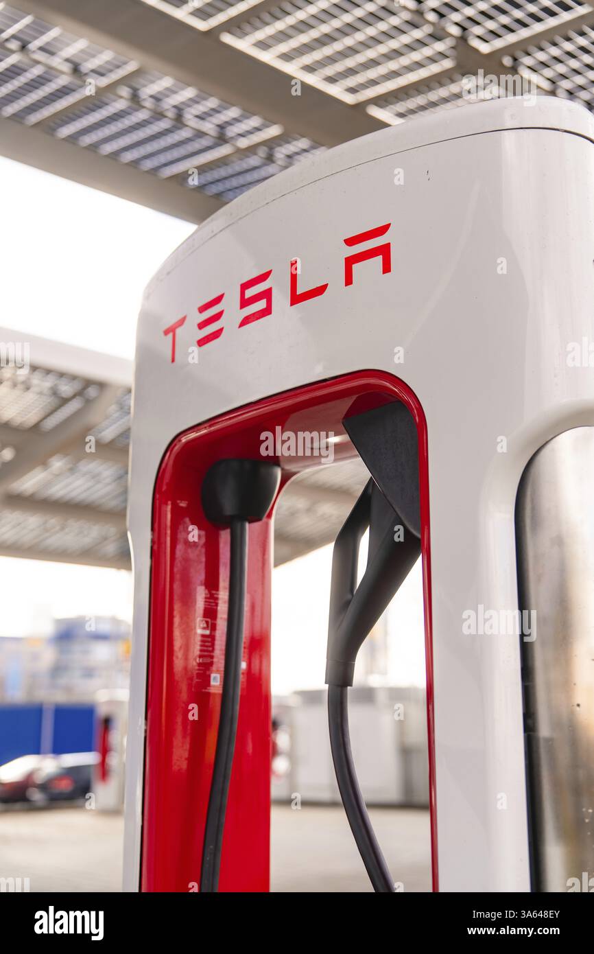 Close-up of a Tesla charging station under a modern canopy, Tesla, New ...