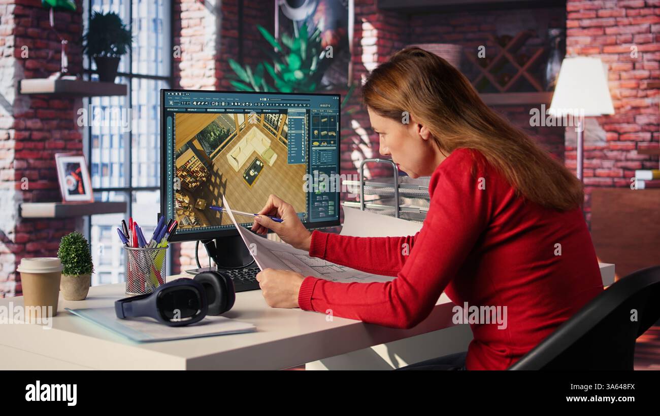 Remote worker in creative office uses CAD software and blueprints plan ...