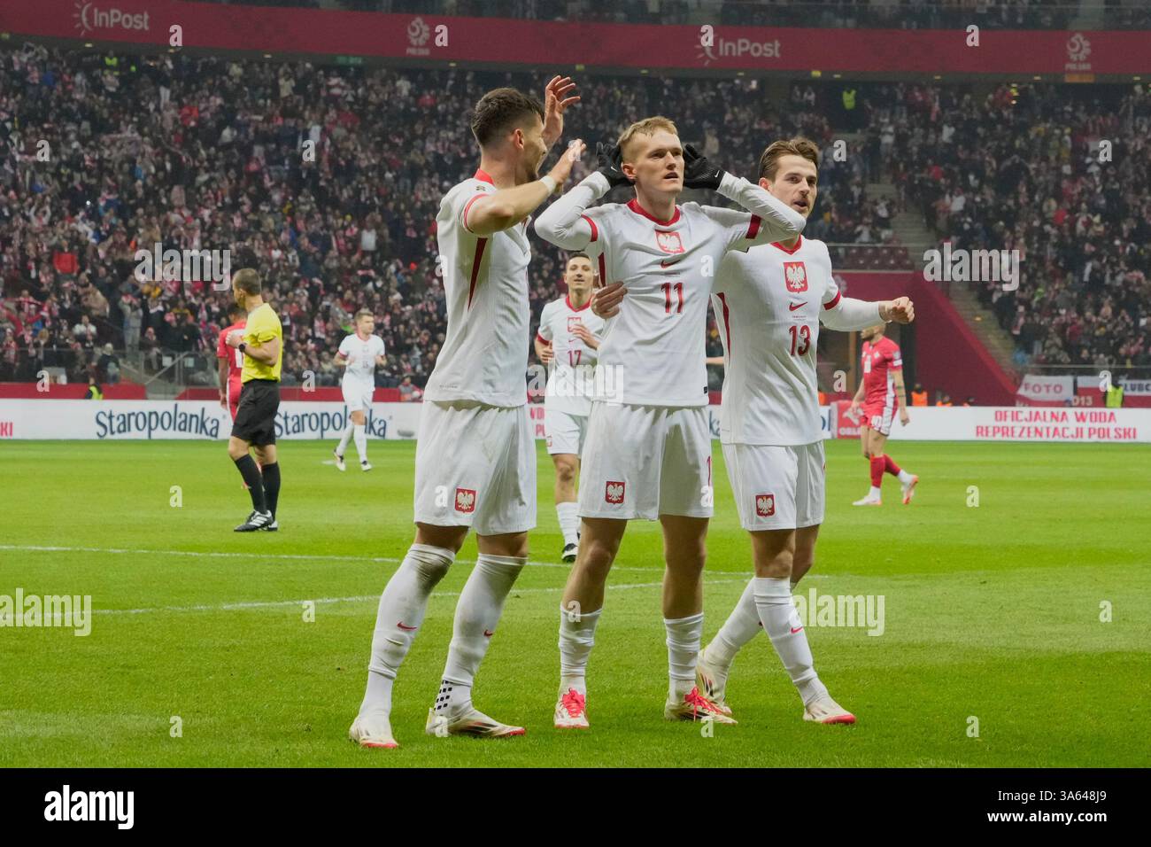 Poland's Karol Swiderski, center, celebrates with teammates after ...
