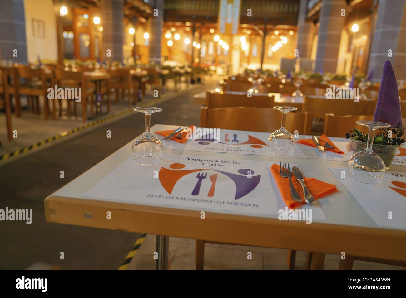 Set tables with table decorations in a cosy church interior ...
