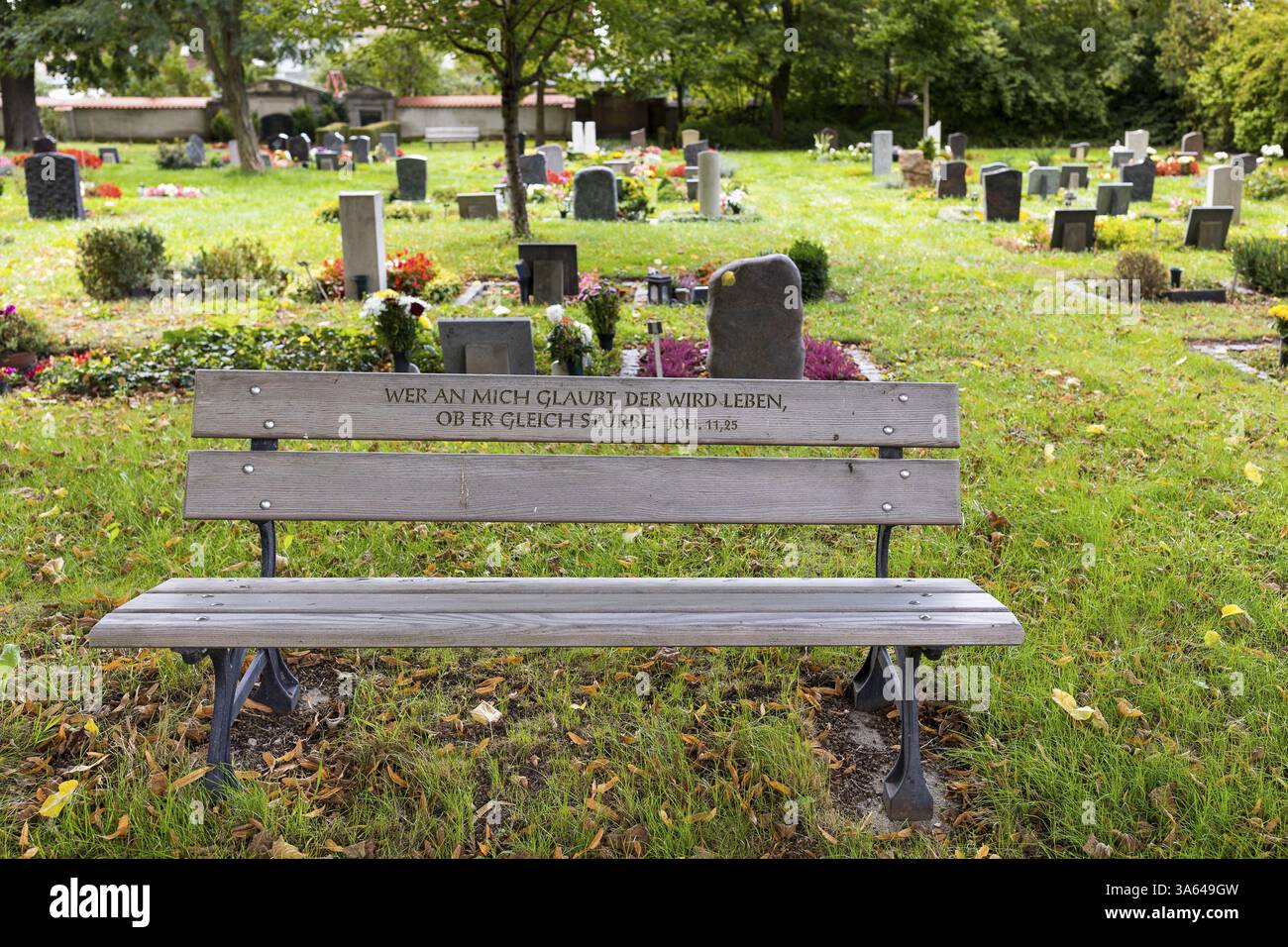 Bench with Bible verse between graves, Alleestrasse cemetery, Riesa ...