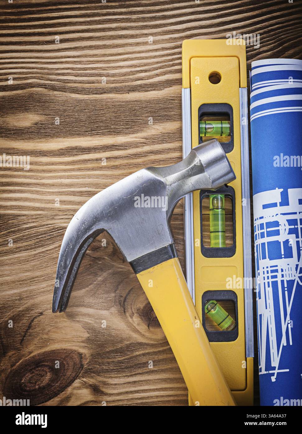 Construction level engineering drawing claw hammer on vintage wooden ...