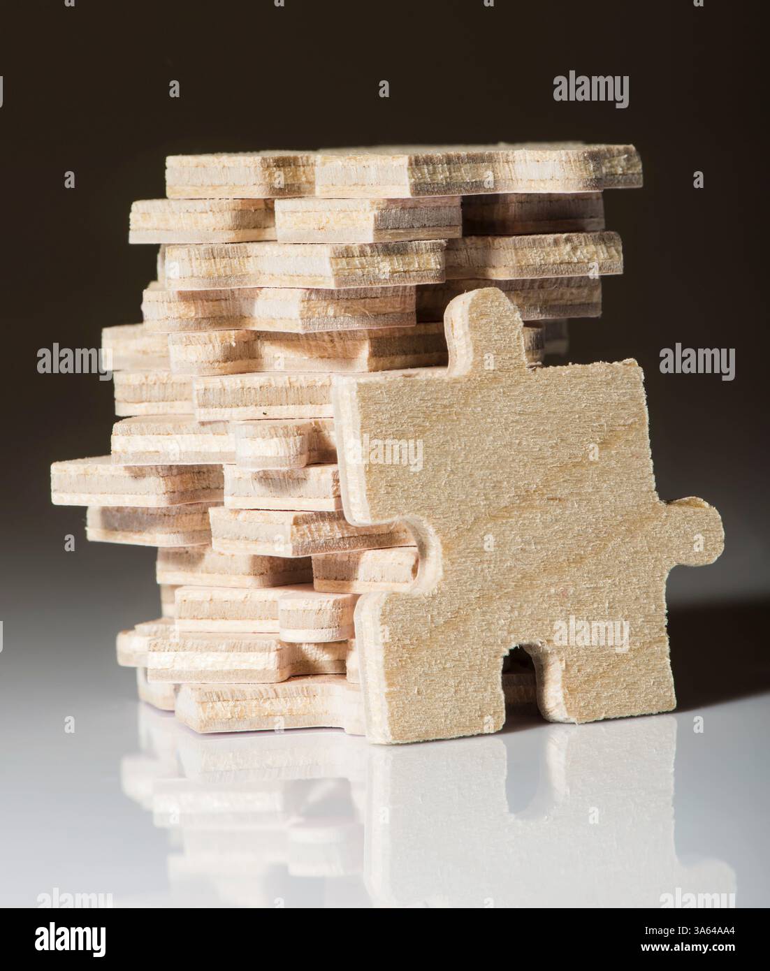 Wooden puzzle on white background. Pile of puzzle Stock Photo - Alamy