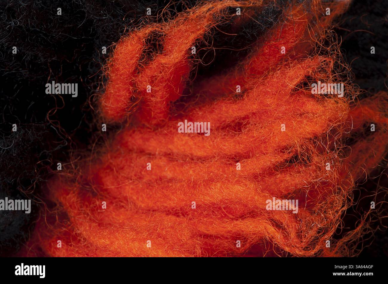 Black and red wool fibers closeup Stock Photo - Alamy