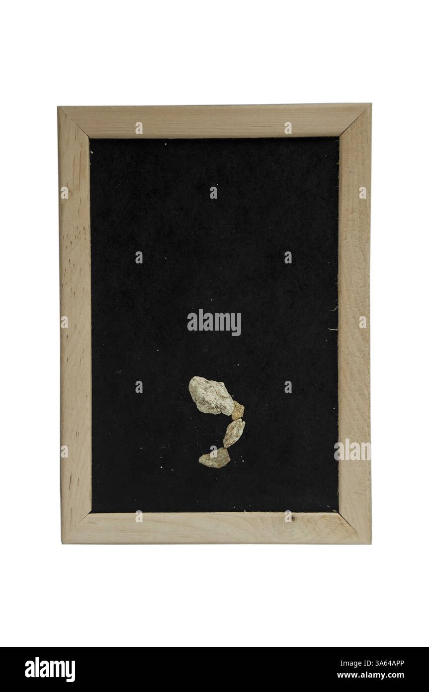 Comma stone made on black background in frame Stock Photo - Alamy