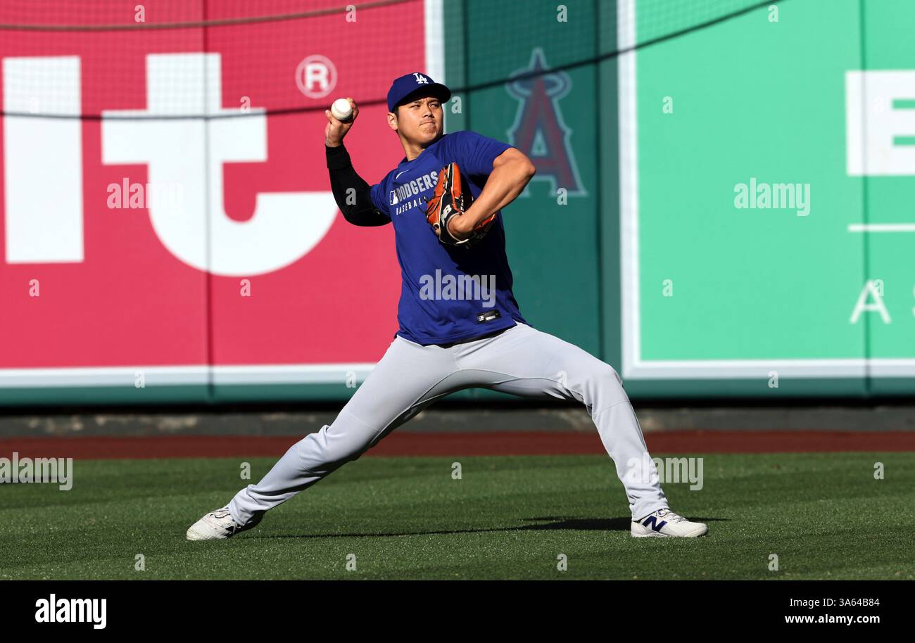 Los Angeles Dodgers' Shohei Ohtani throws in the outfield before a ...