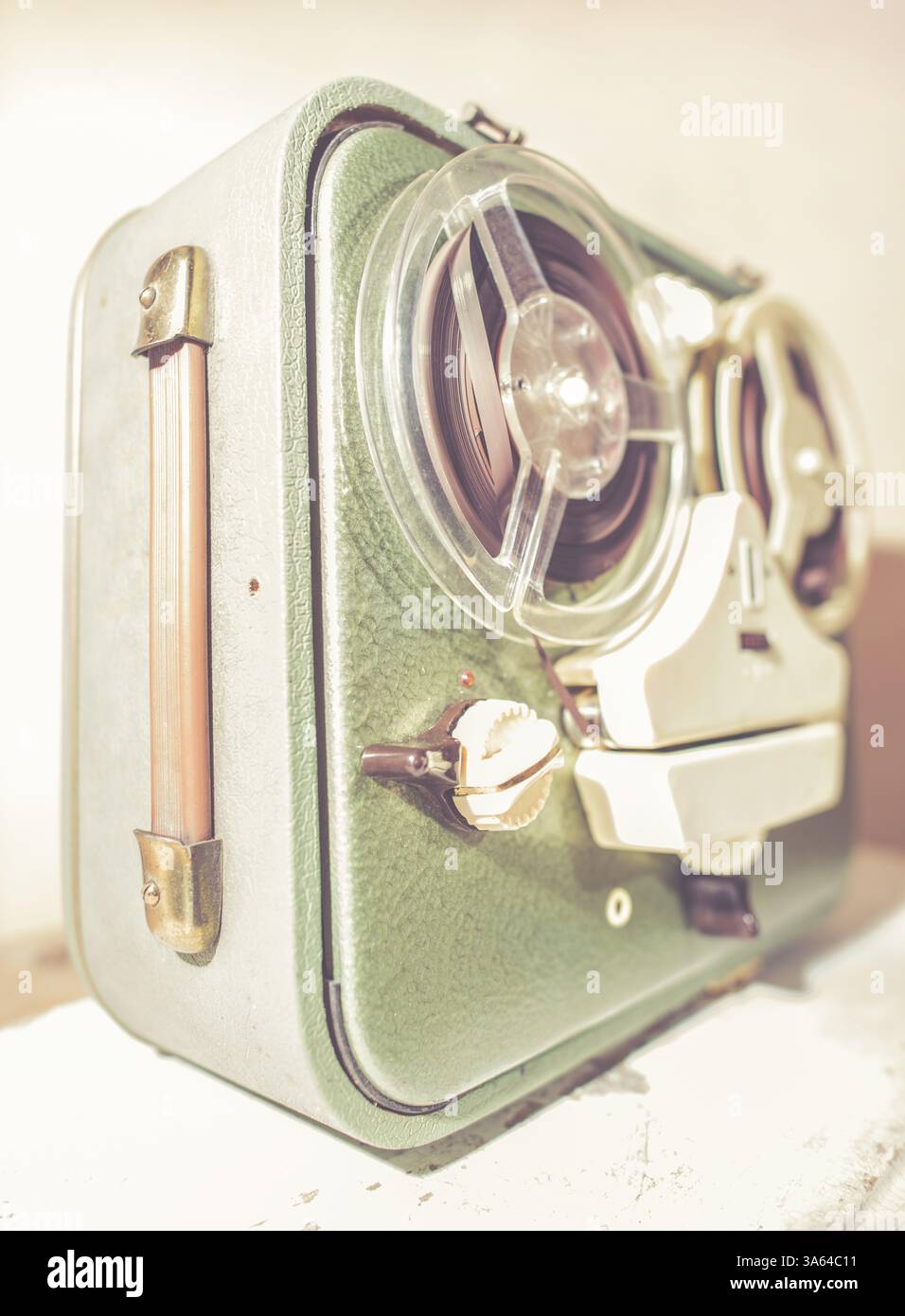 Old vintage green tape recorder on pink wall Stock Photo - Alamy