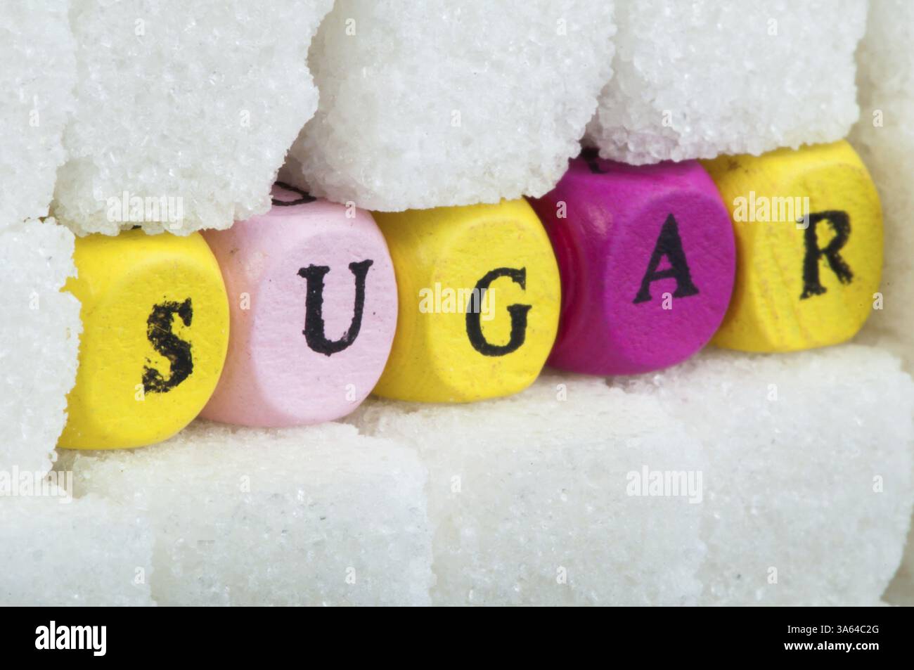 Sugar lumps and word sugar. Multicolored cubes Stock Photo - Alamy