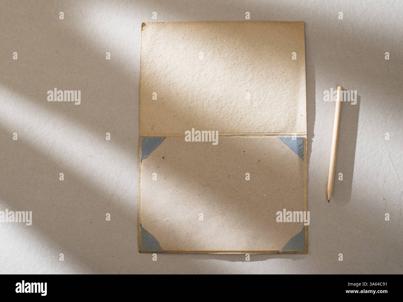 Vintage pencil and drawing paper. Weak sunlight Stock Photo - Alamy