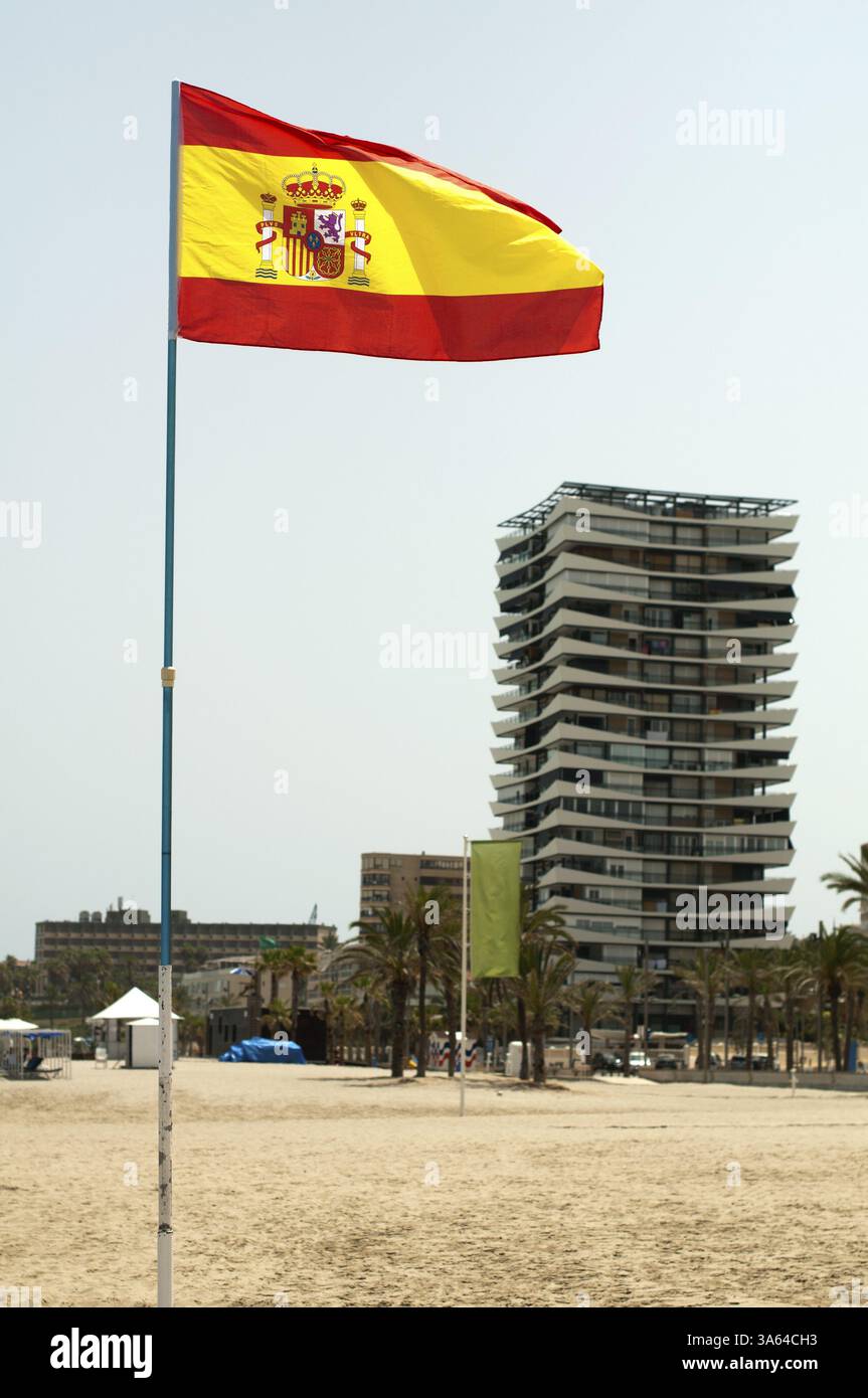 Spanish coastal resort and spanish flag Stock Photo - Alamy