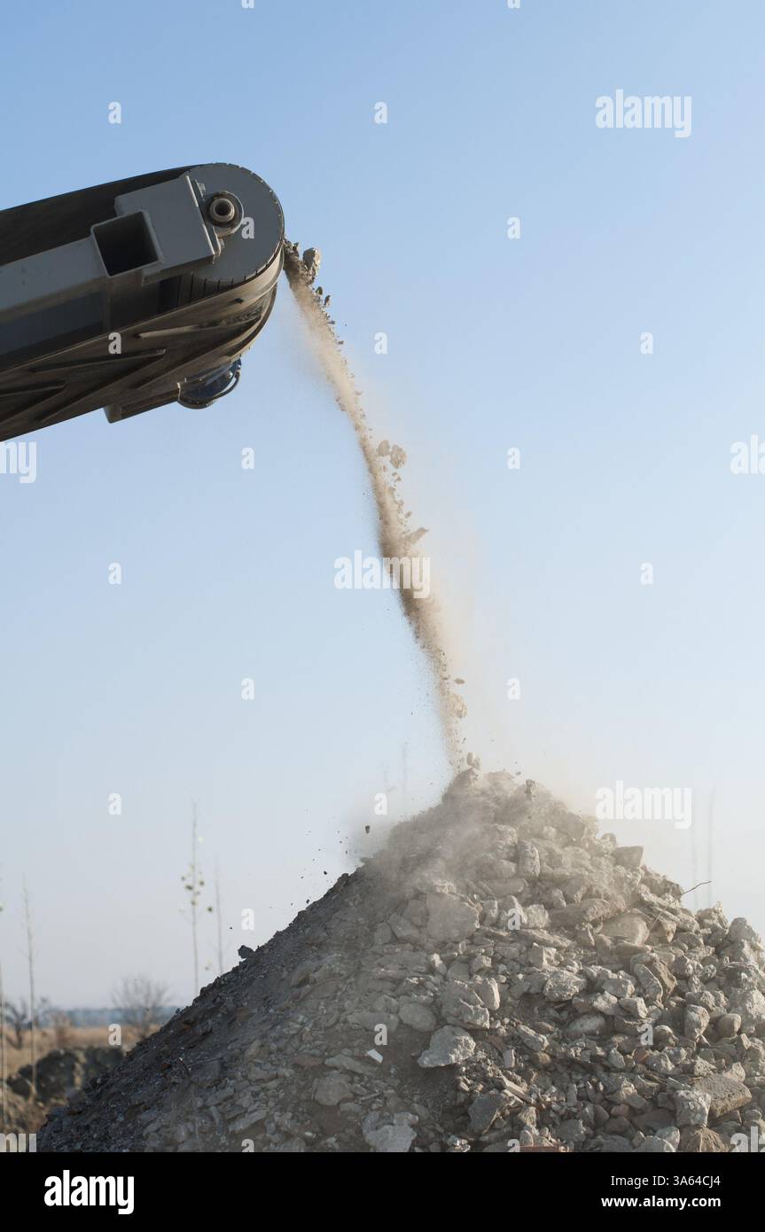 Machine for crushing stone. Falling rocks Stock Photo - Alamy