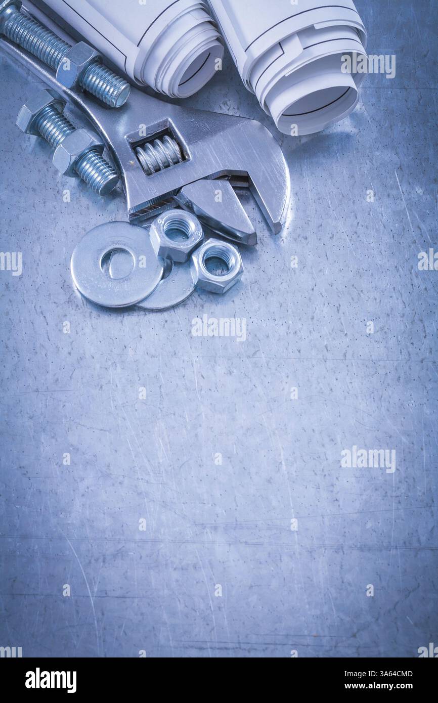 Adjustable spanner bolt washers nuts bolts and rolled up construction ...