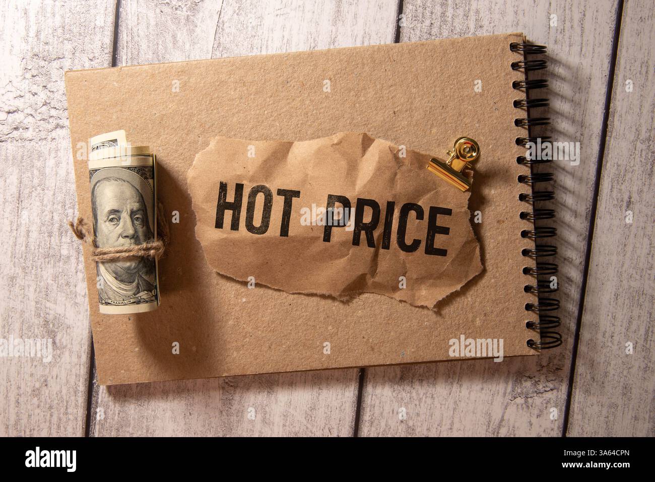 Three tags hanging from a string with the words hot price written below ...
