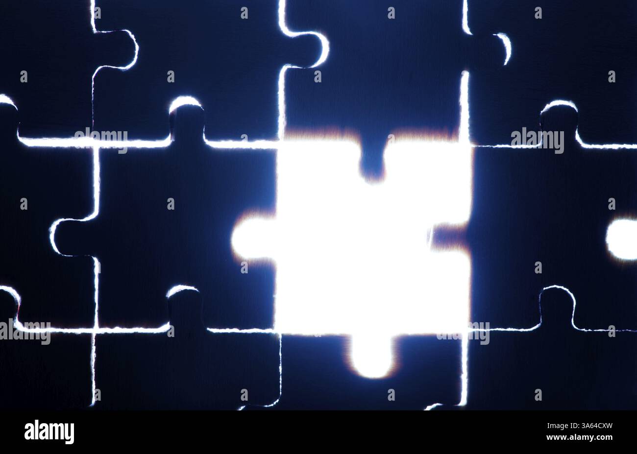 Wooden puzzle and backlight background. Close up. Blue color light ...