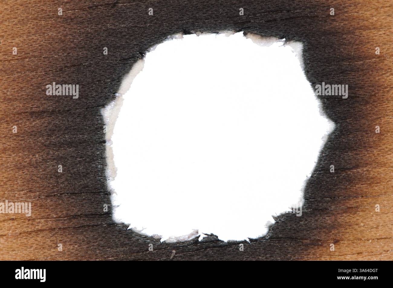 Burned paper hole hi-res stock photography and images - Alamy