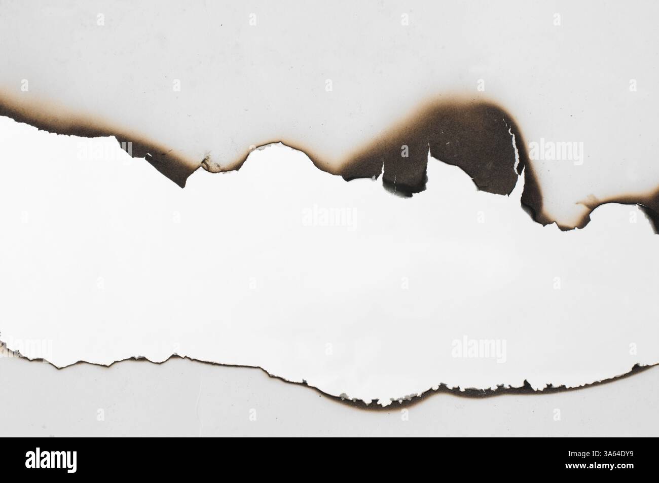 Burned paper and close up hole Stock Photo - Alamy