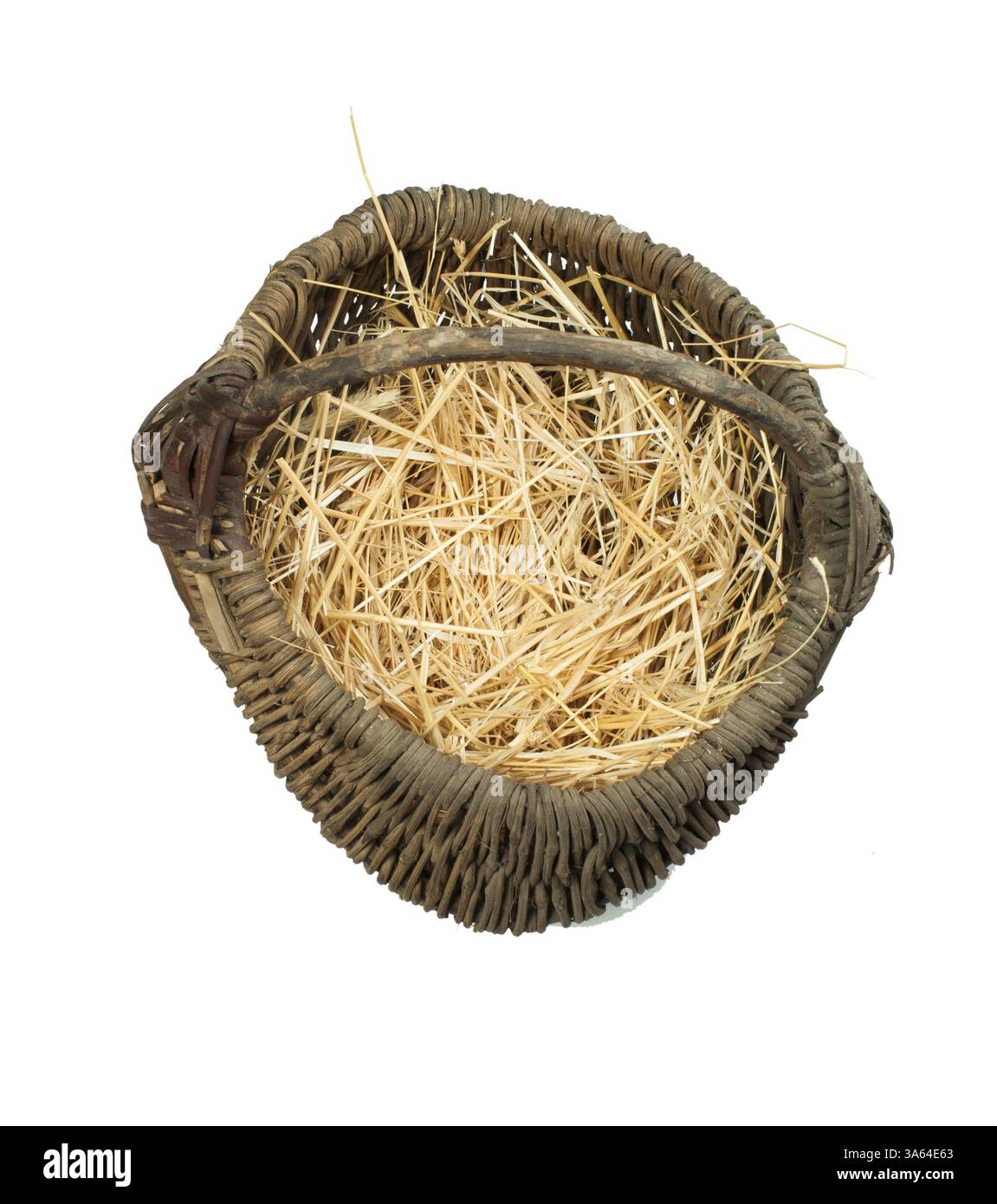 Old wicker basket with straw inside.White isolated Stock Photo - Alamy