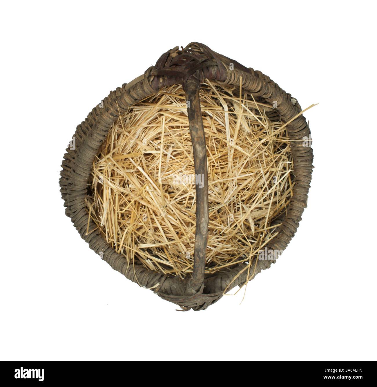 Old wicker basket with straw inside.White isolated Stock Photo - Alamy