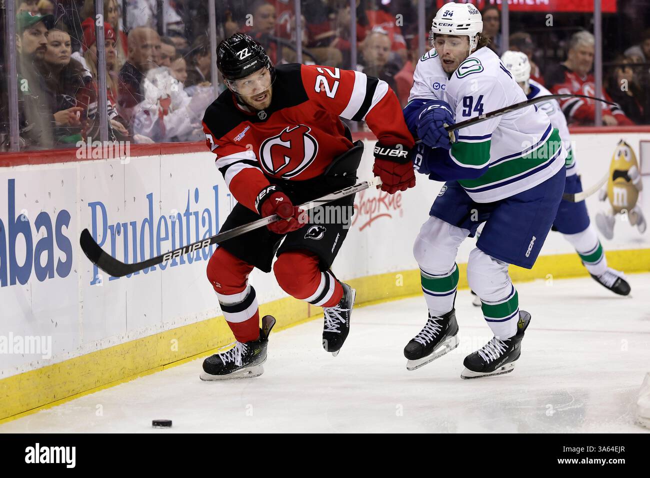 New Jersey Devils defenseman Brett Pesce (22) and Vancouver Canucks ...