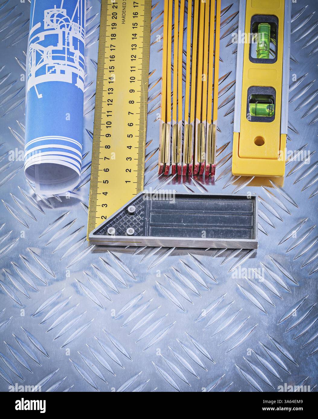Construction plans level wooden meter try square on grooved metal plate ...