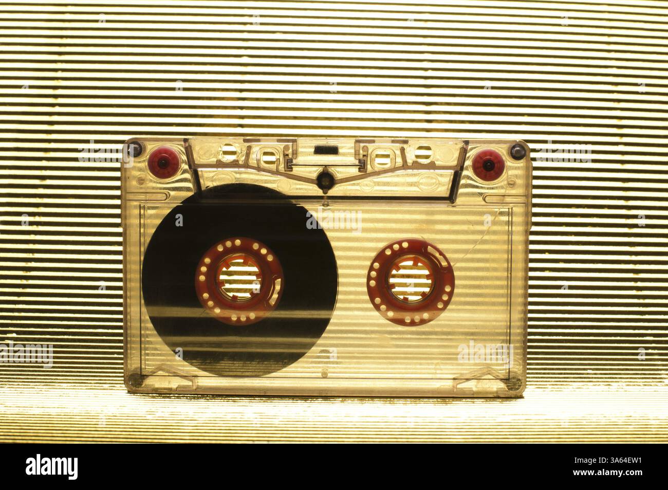 Transparent Cassette tape. Gold color background Stock Photo - Alamy