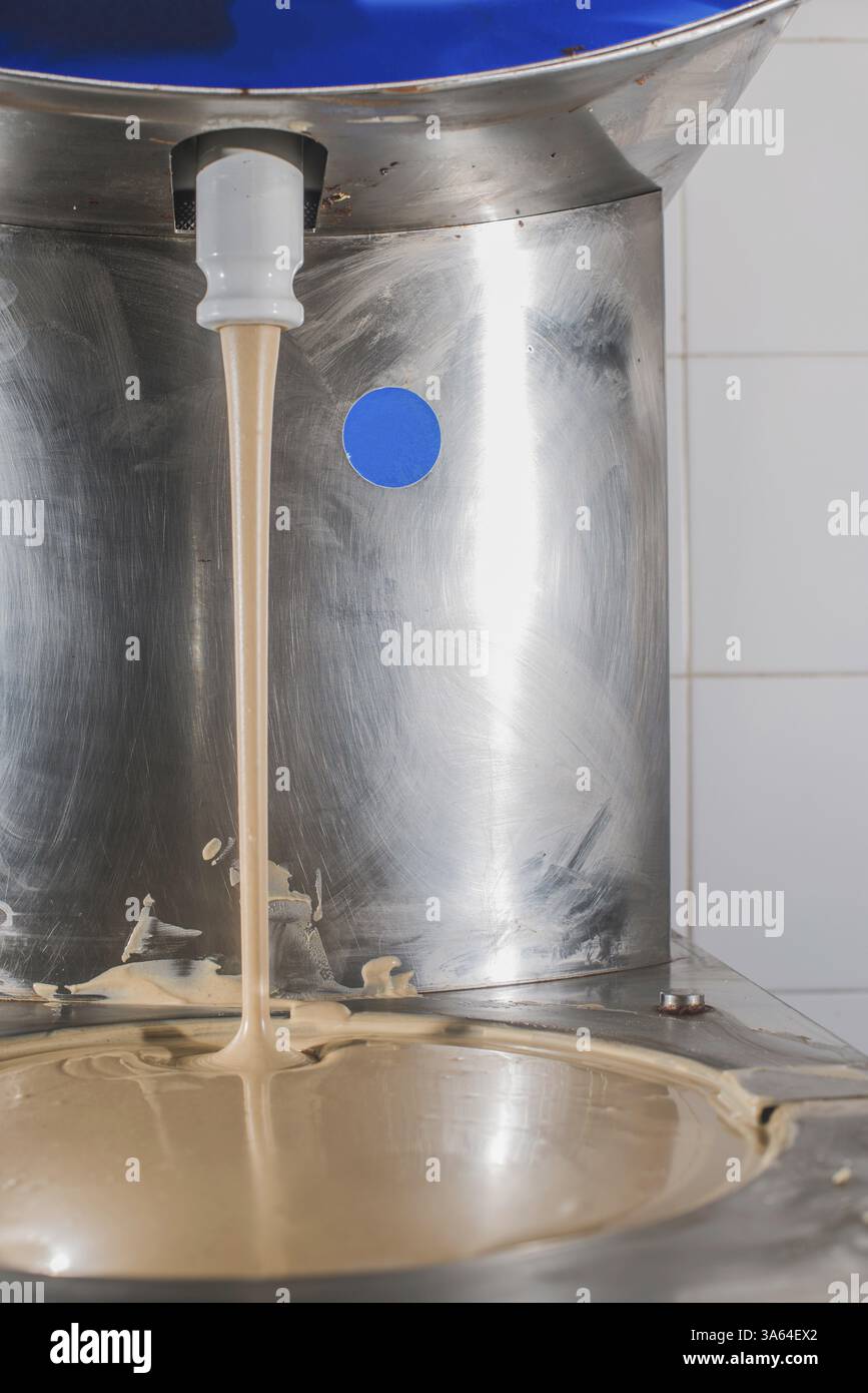 Machine mixing chocolate in factory. Bulgaria Stock Photo - Alamy