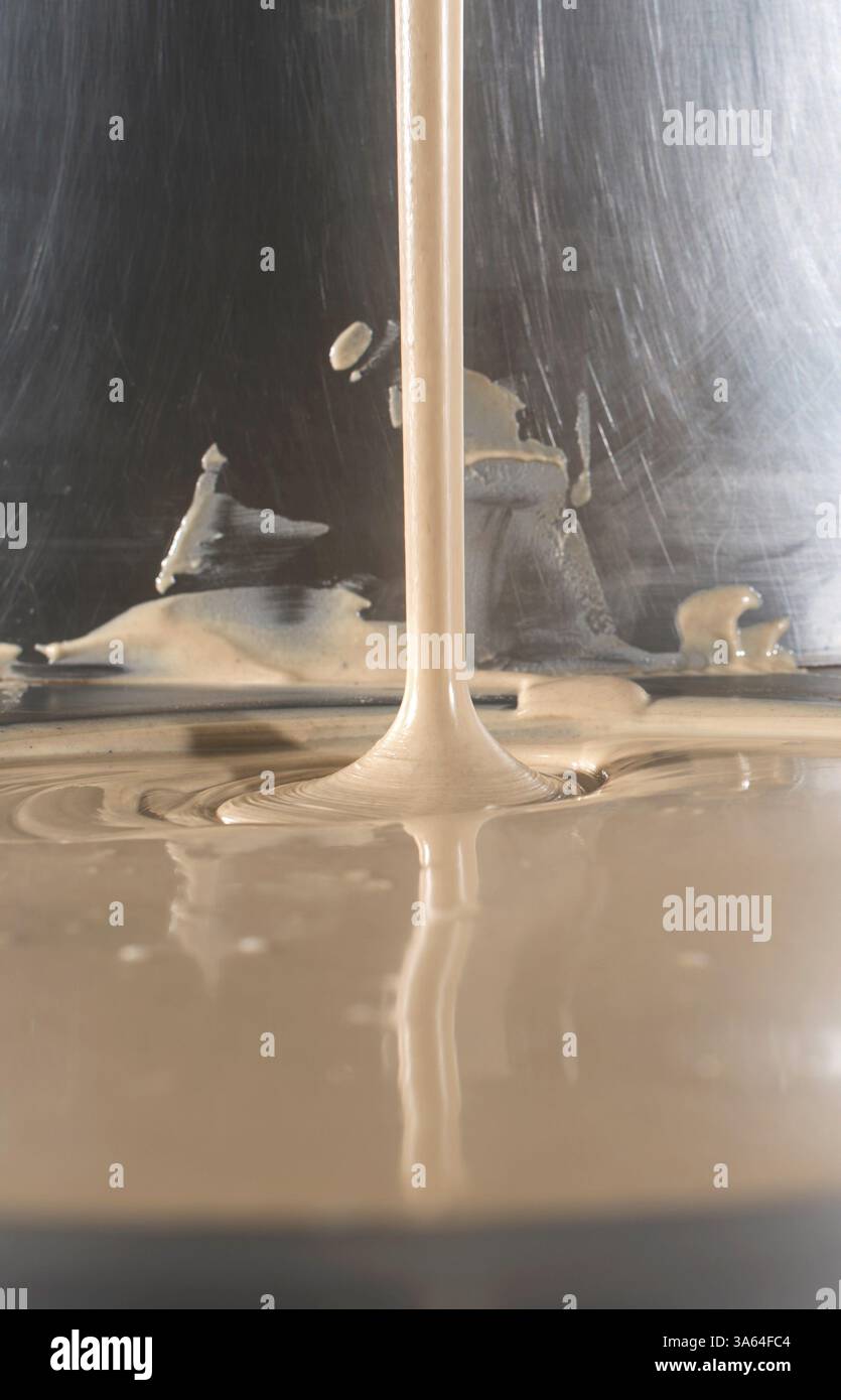 Machine mixing chocolate in factory. Bulgaria Stock Photo - Alamy