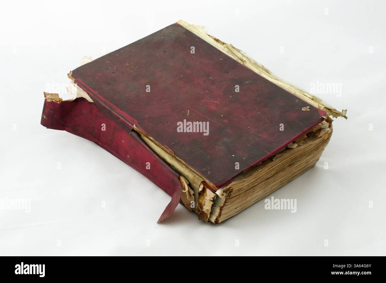 Fragmented old worn book with red cover. White isolated Stock Photo - Alamy