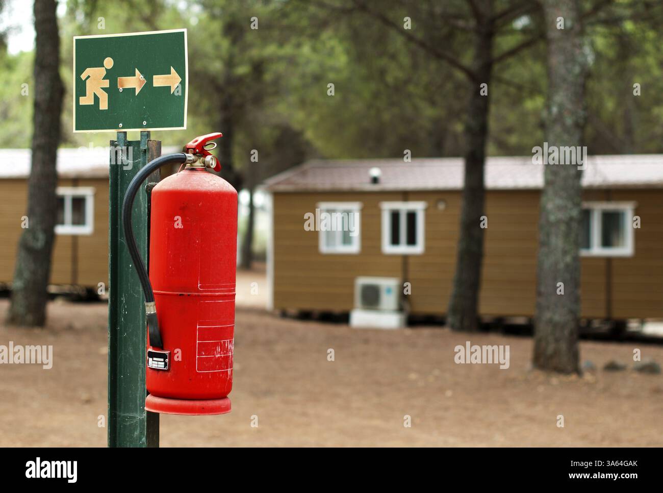 Red fire extinguisher and mobile homes. Fire safety Stock Photo - Alamy