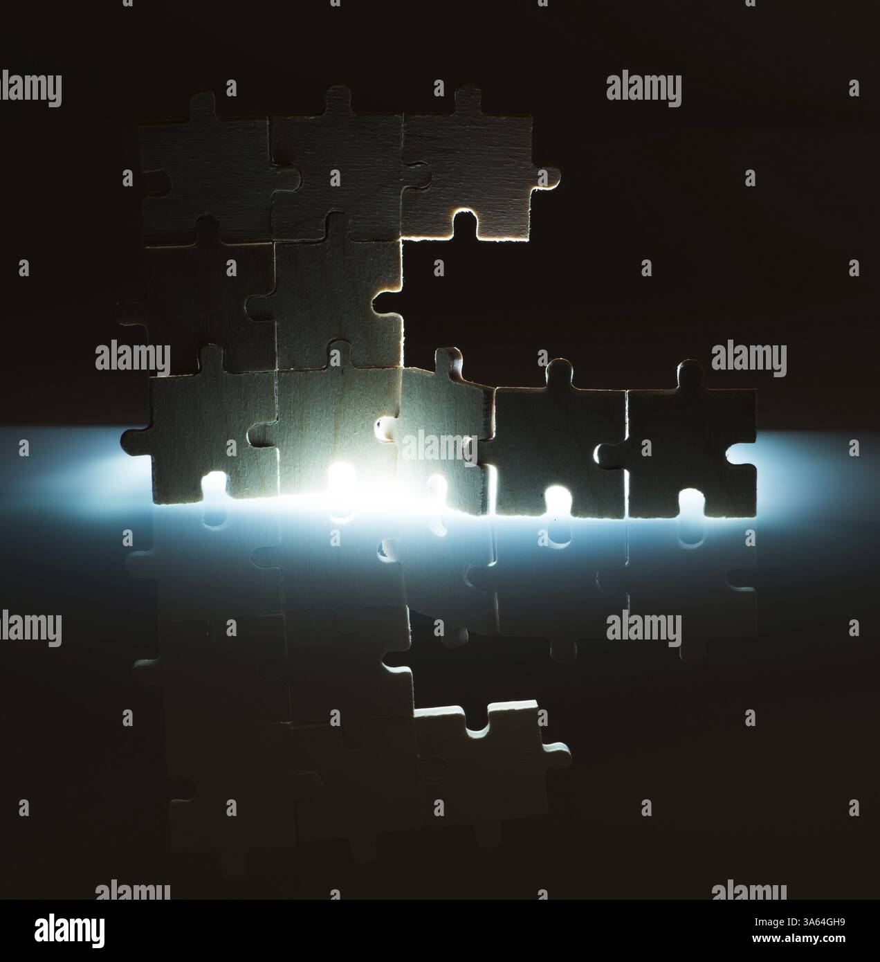 Wooden puzzle and backlight background. Vertically stacked parts Stock ...