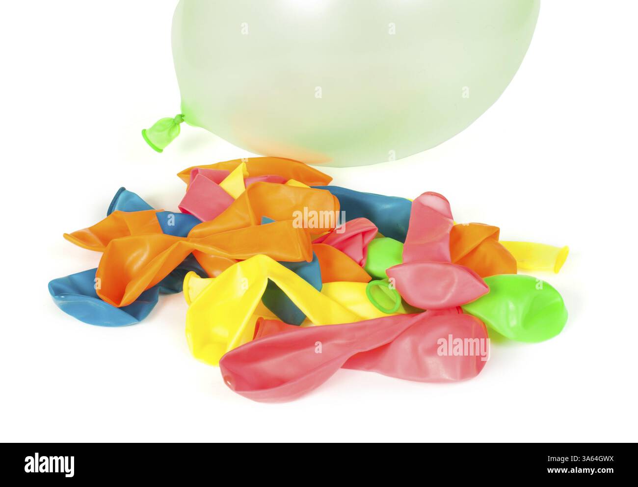Pile of uninflated balloons from different colors. White isolated Stock ...
