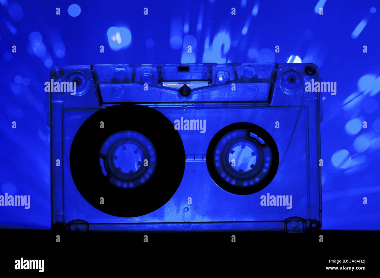 Transparent Cassette tape and blue color disco light background Stock ...