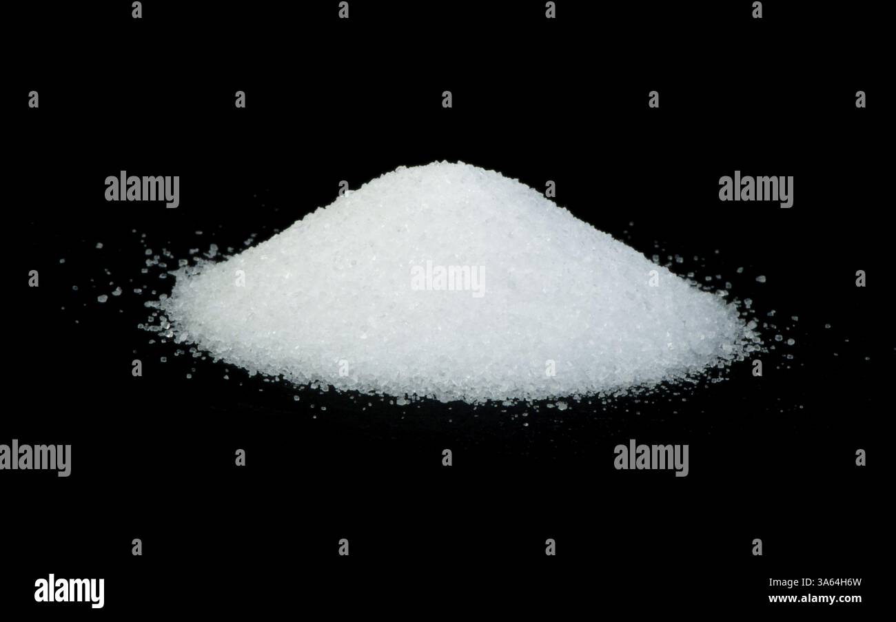 Pile of salt on black background Stock Photo - Alamy