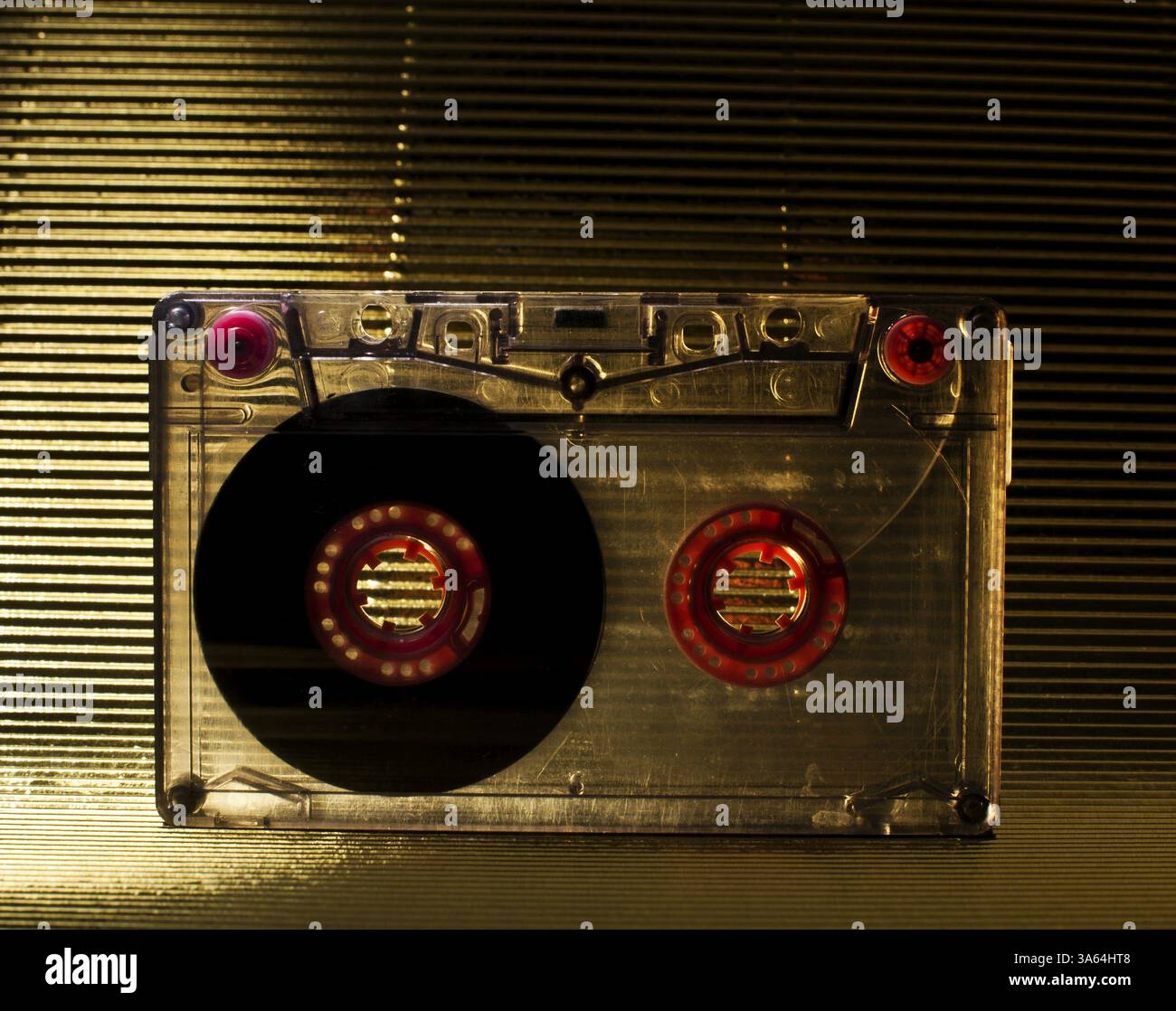 Transparent Cassette tape. Gold color background Stock Photo - Alamy