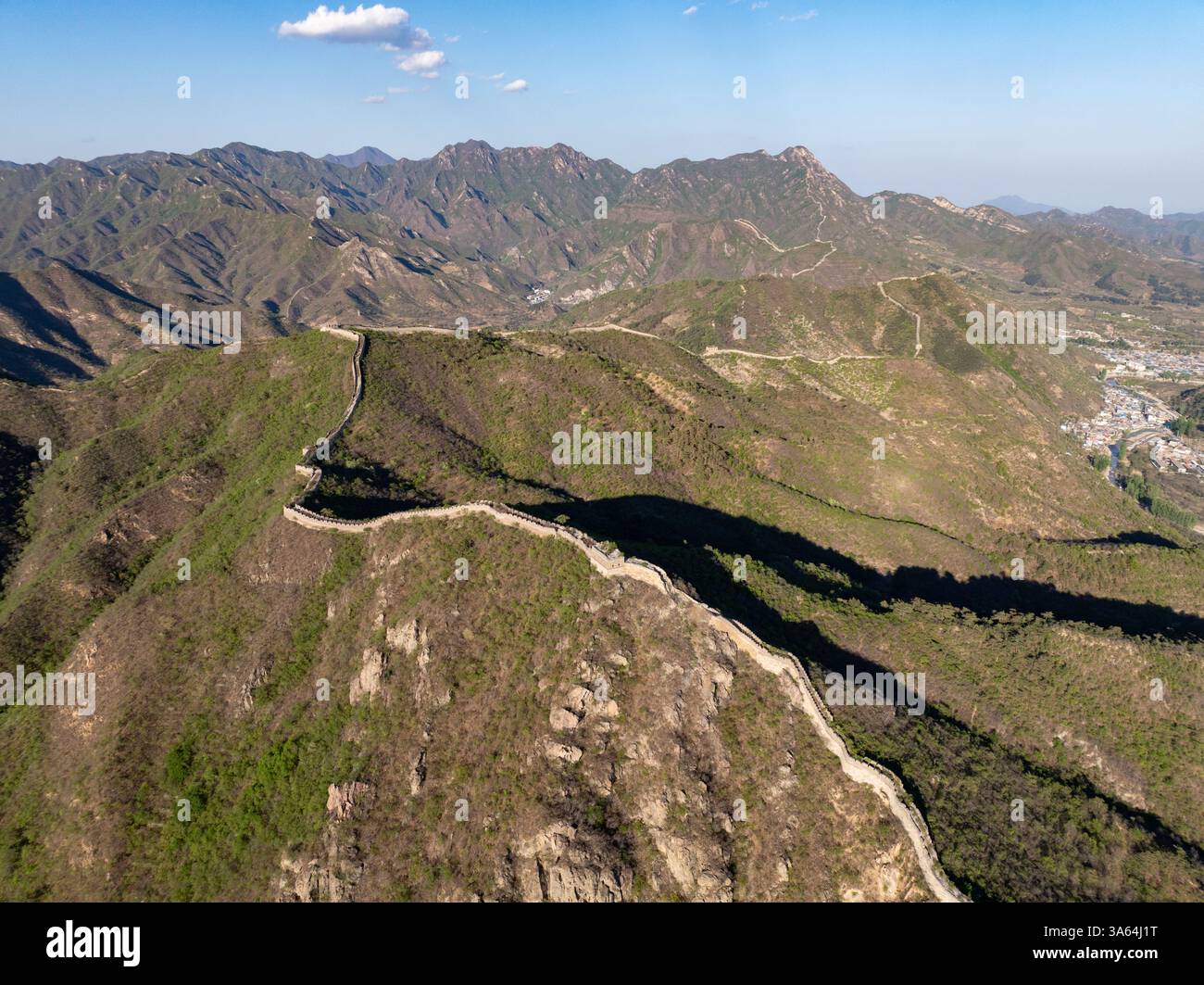 A section of wild wall surround the preserved Great Wall section at ...