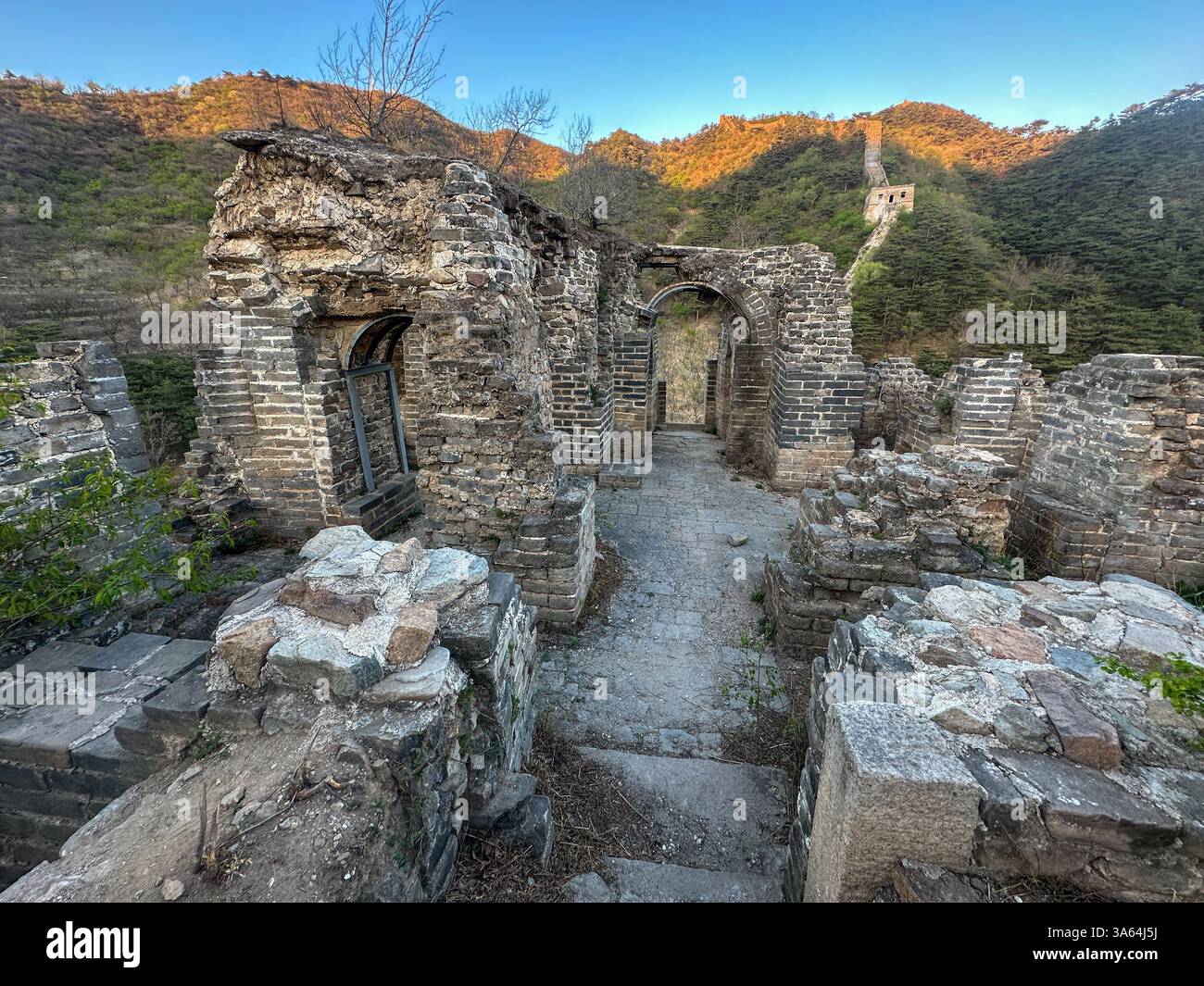 A section of wild wall surround the preserved Great Wall section at ...
