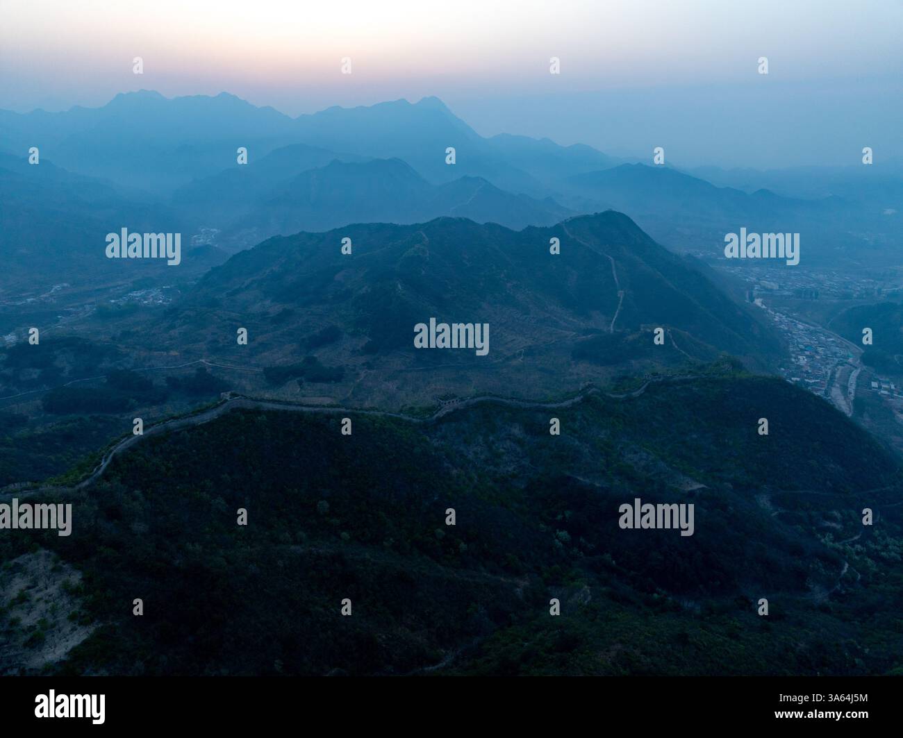 A section of wild wall surround the preserved Great Wall section at ...