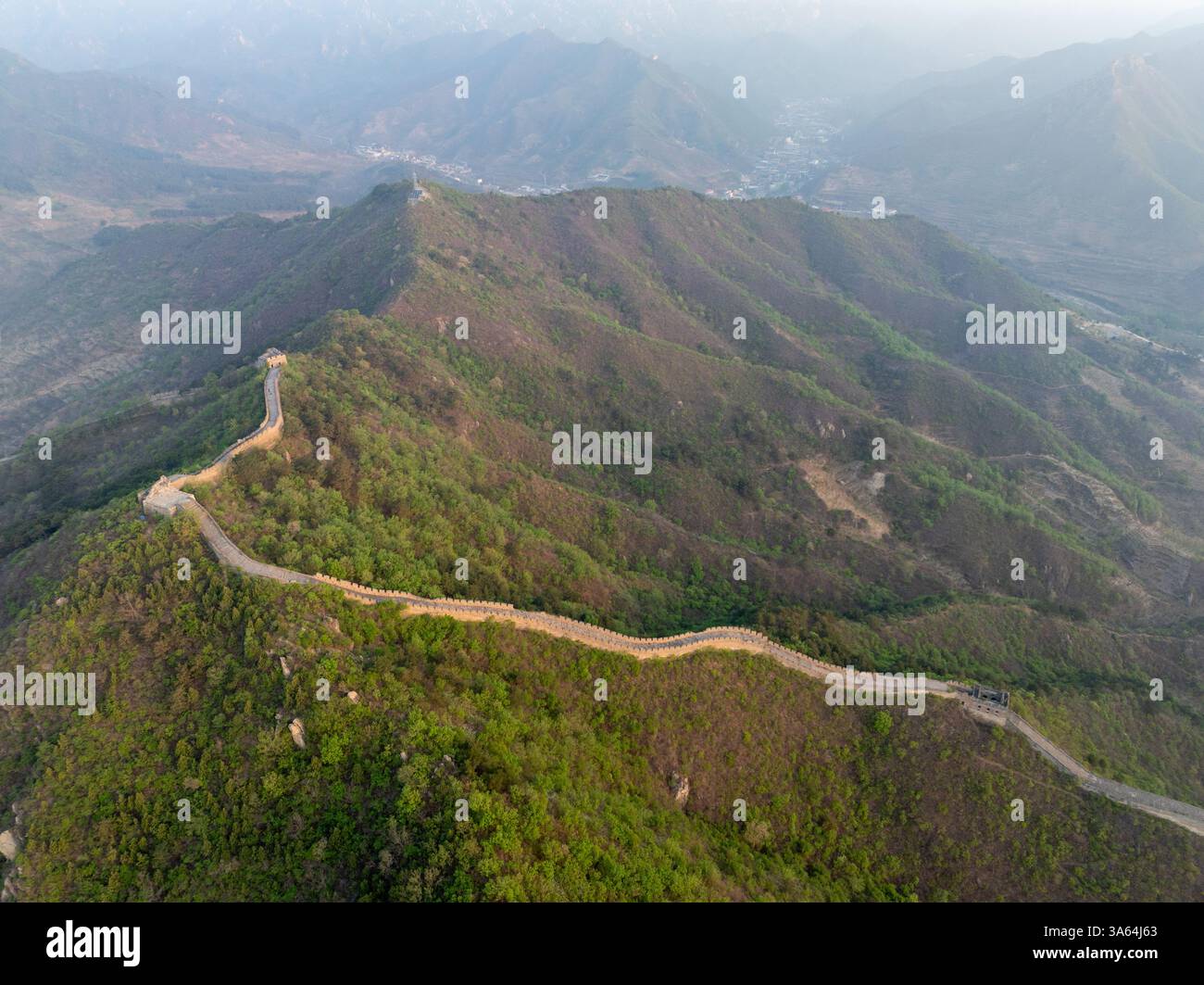 A section of wild wall surround the preserved Great Wall section at ...