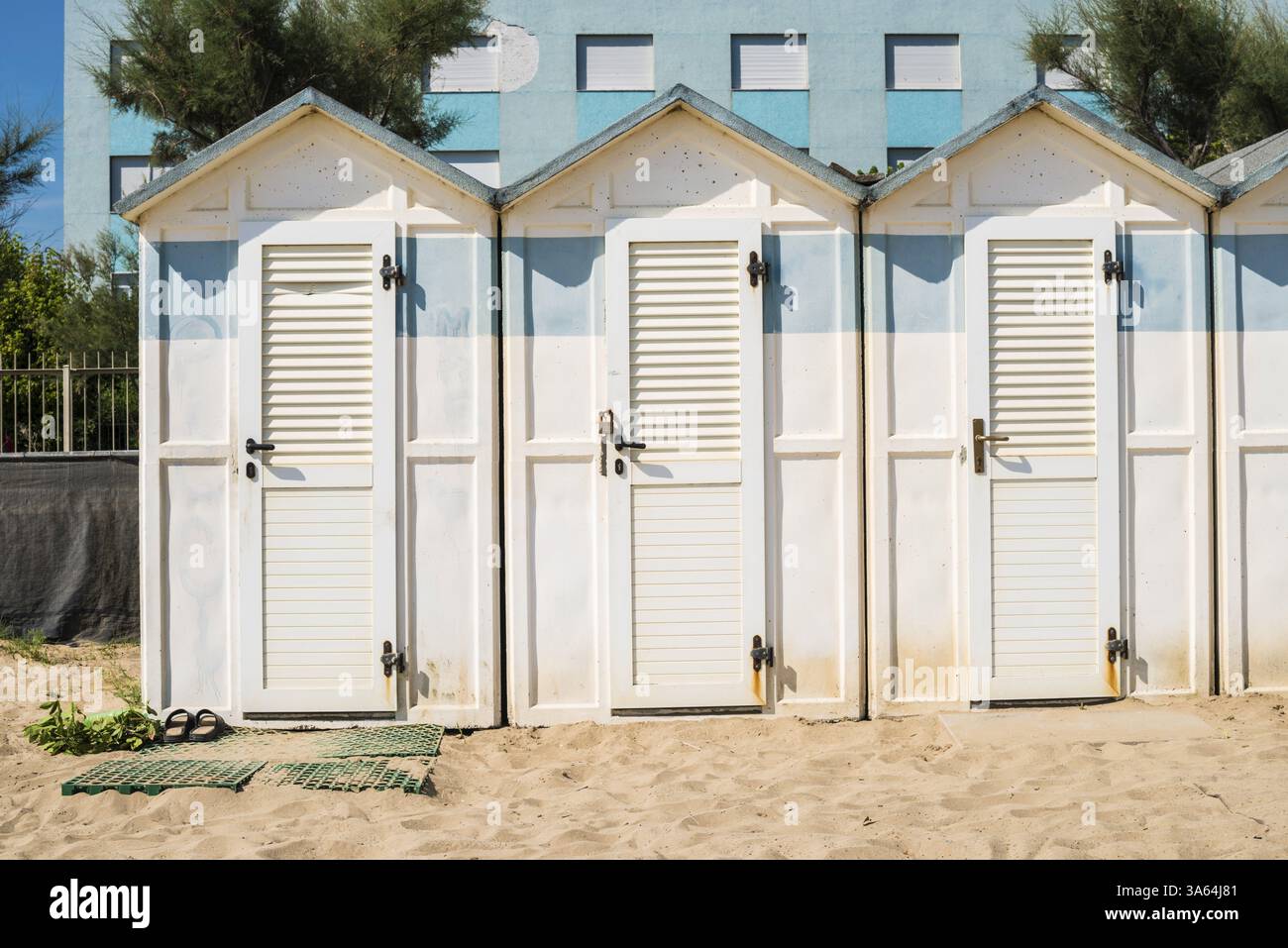 White wooden cabins on the beach Stock Photo - Alamy