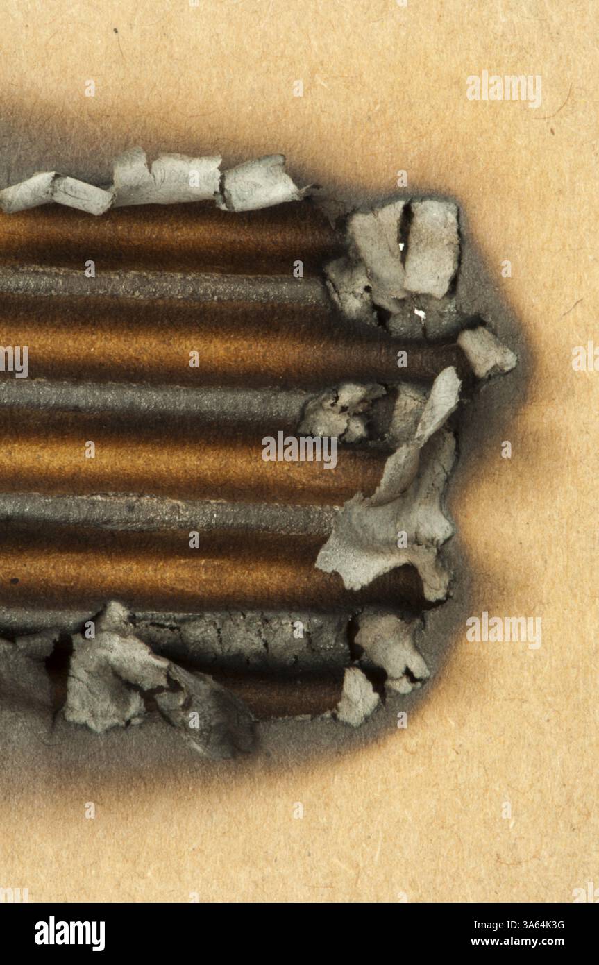 Burned paper and close up hole Stock Photo - Alamy