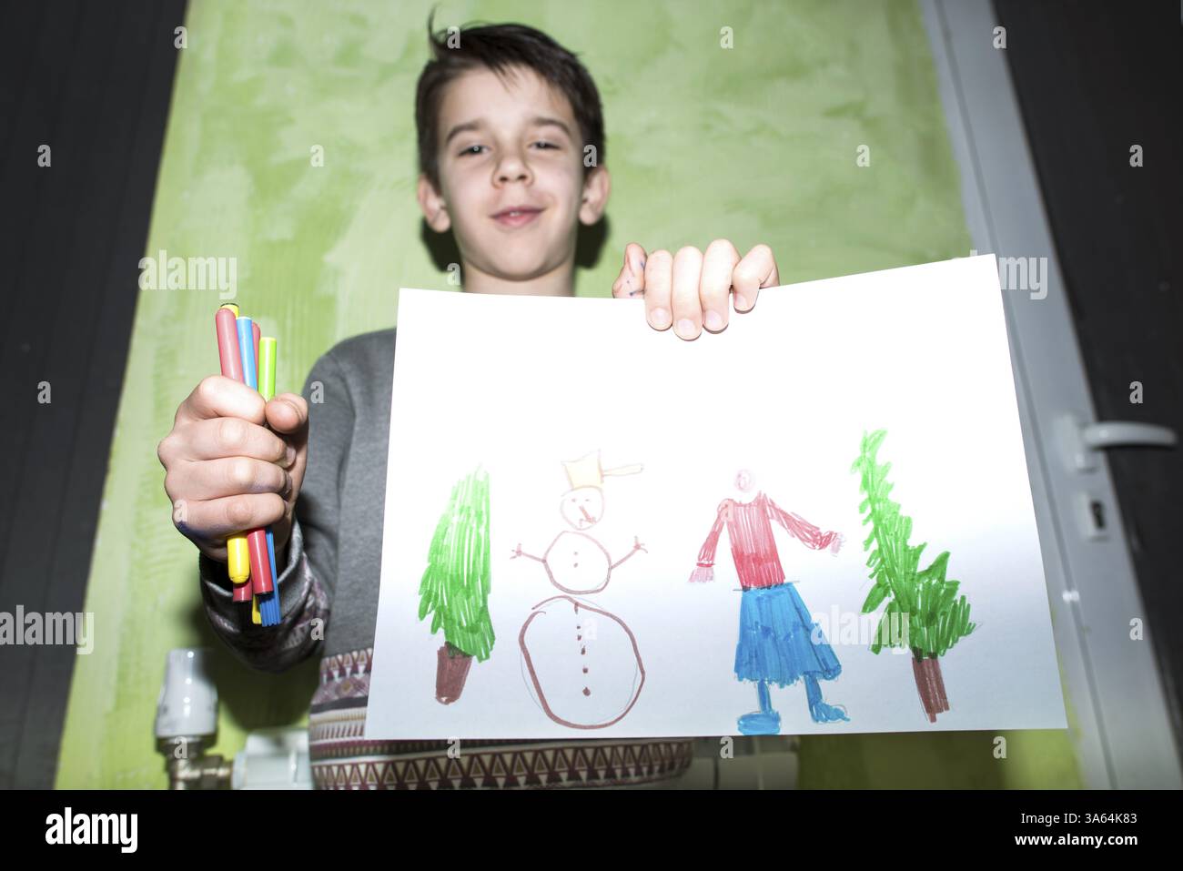 Child shows picture. Direct on camera flash Stock Photo - Alamy