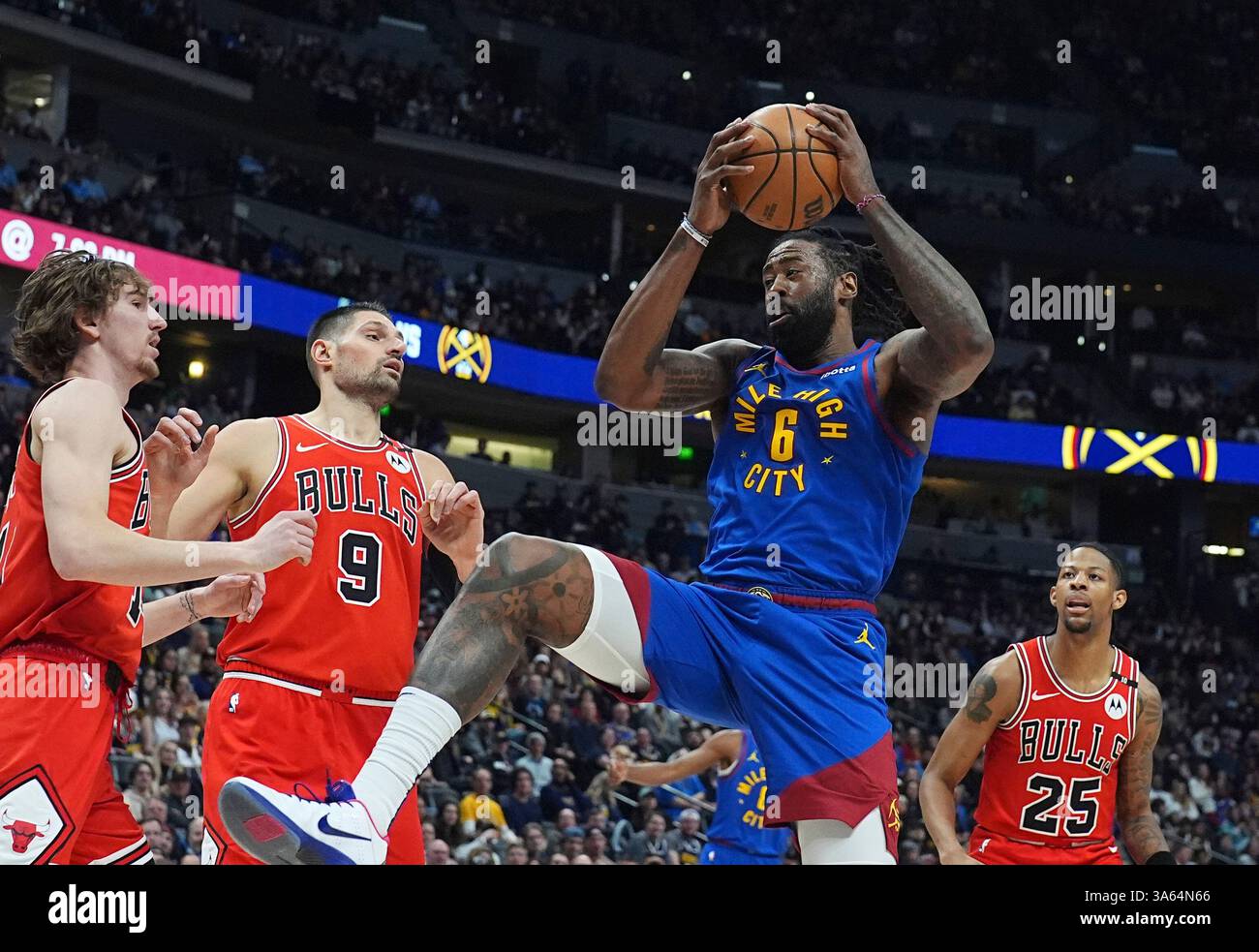 Denver Nuggets center DeAndre Jordan, third from left, pulls in a ...