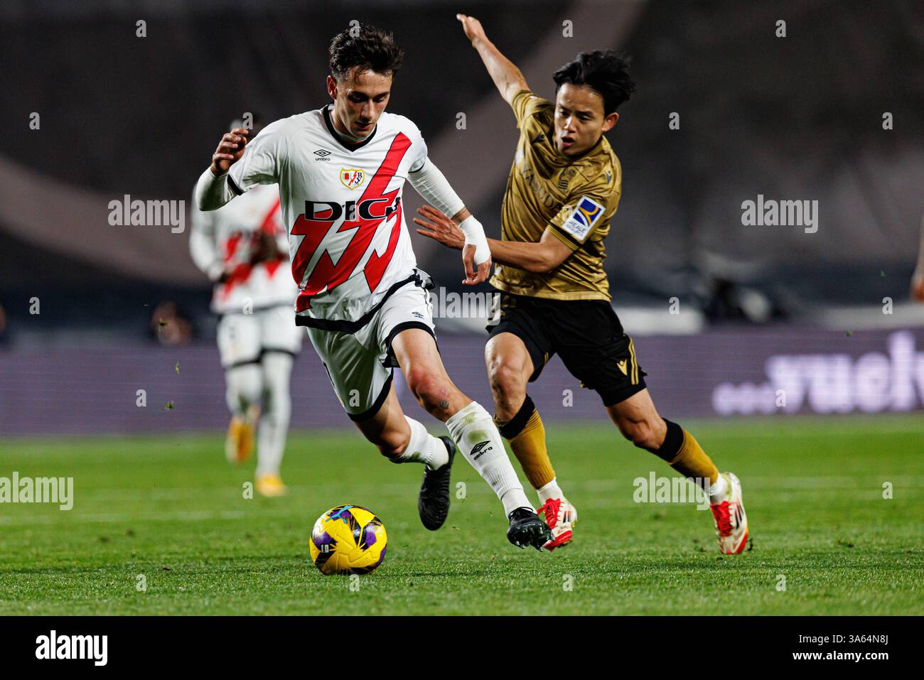 Pedro Diaz of Rayo Vallecano and Takefusa Kubo of Real Sociedad de ...