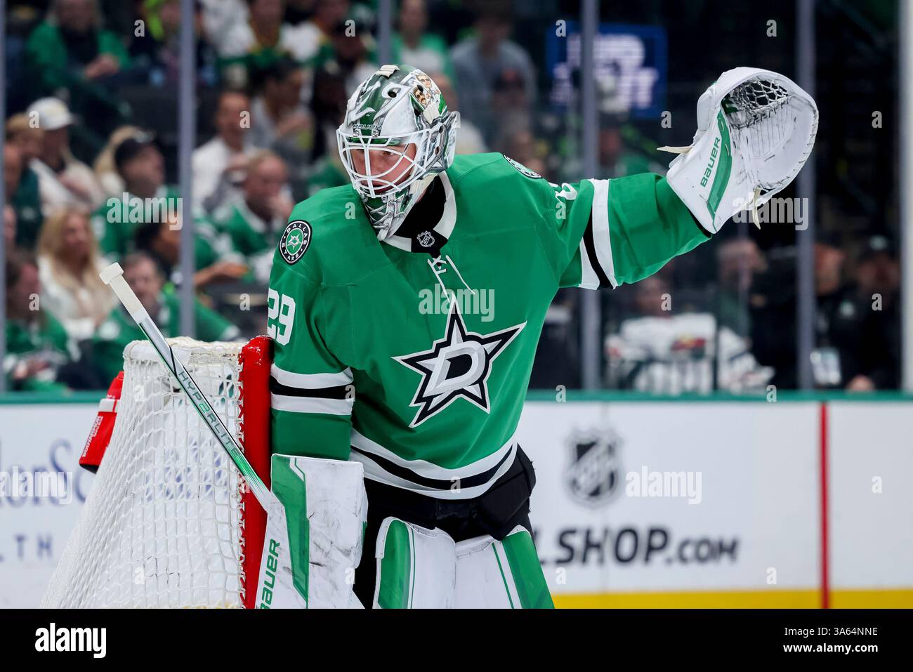 Dallas Stars goaltender Jake Oettinger signals to his team during an ...