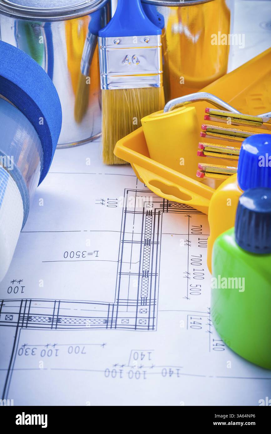 Construction plan with articles for painting duct tape and wooden meter ...