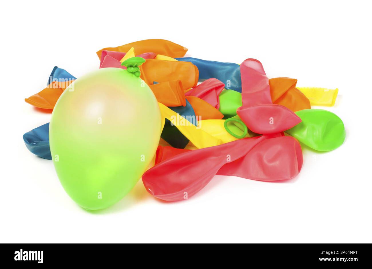 Pile of uninflated balloons from different colors. White isolated Stock ...