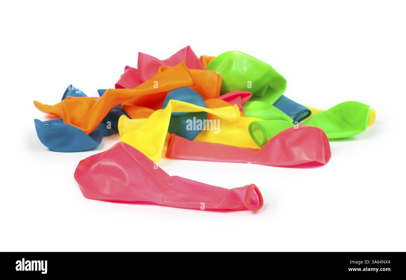 Pile of uninflated balloons from different colors. White isolated Stock ...