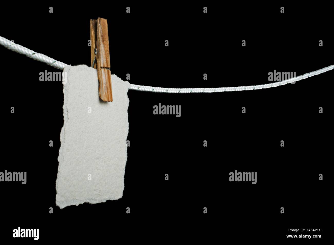 Note papers hooked on a rope. Balck isolated studio shot Stock Photo ...