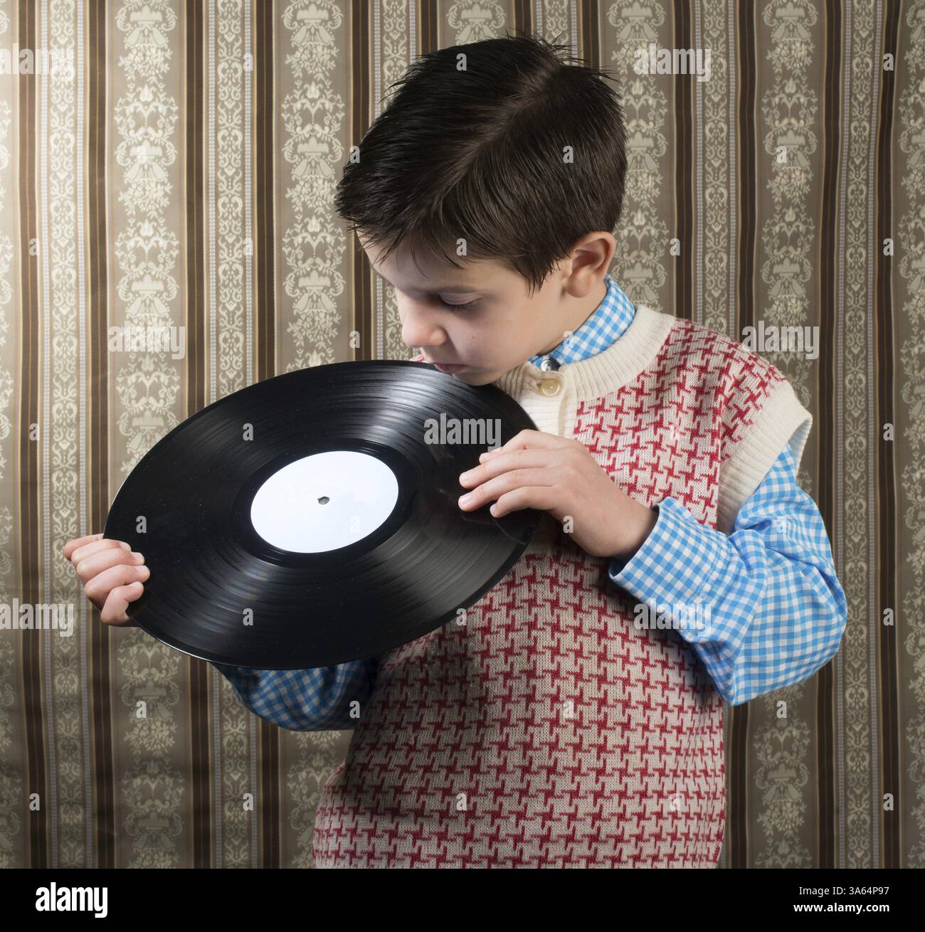 Child hold lp. Vontage clothes Stock Photo - Alamy